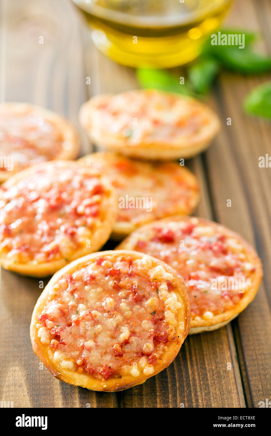 the mini pizza on wooden table Stock Photo - Alamy