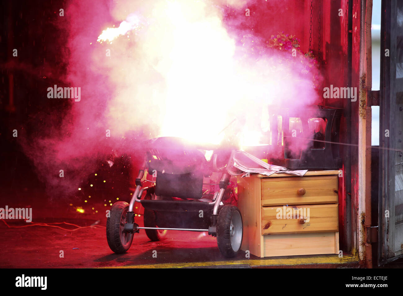 Hamburg, Germany. 19th Dec, 2014. A children's cart burns during a ...