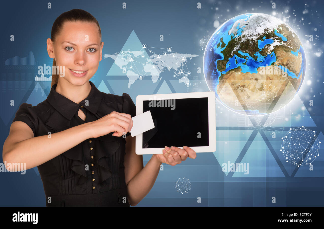 Beautiful businesswoman holding tablet PC. Globe, world map with other ...