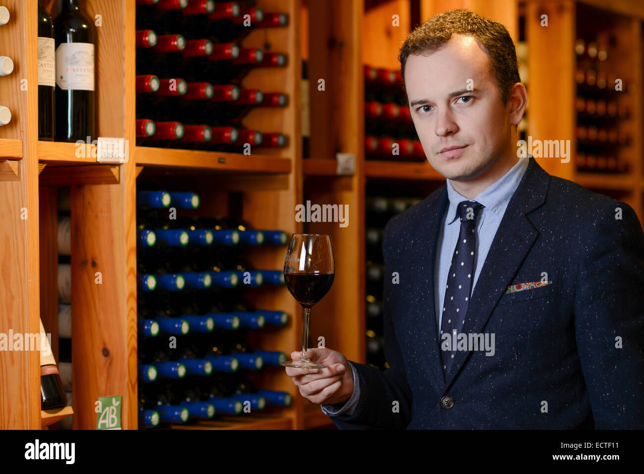 Man at wine rack hi-res stock photography and images - Alamy