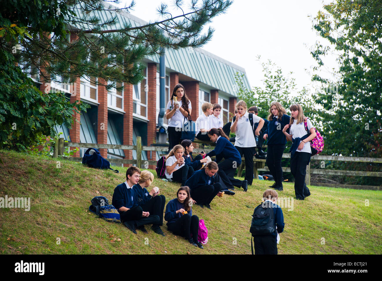 Secondary education Wales UK - school children sitting and talking ...