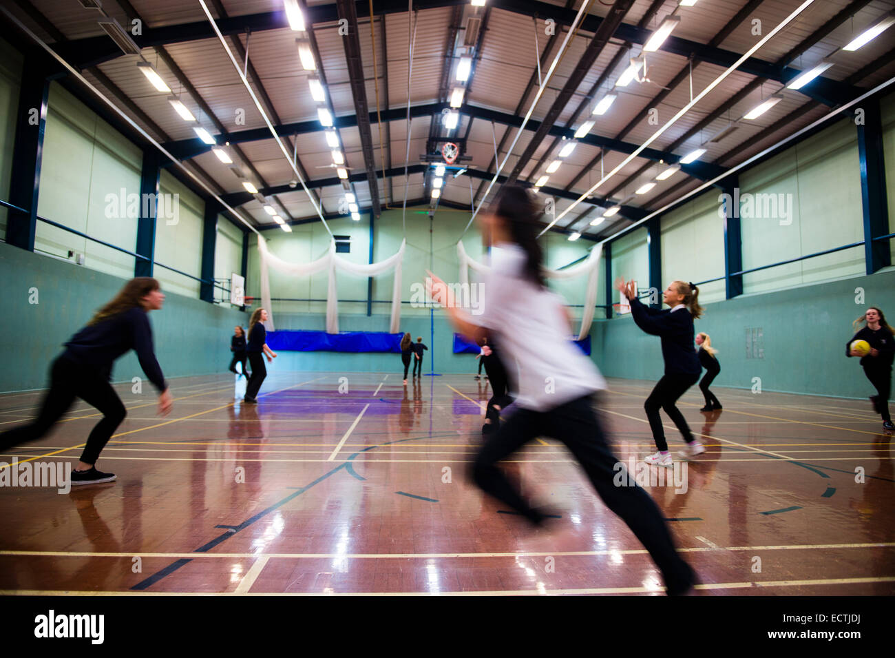 Secondary school physical education Wales UK: teenage girls playing a ...