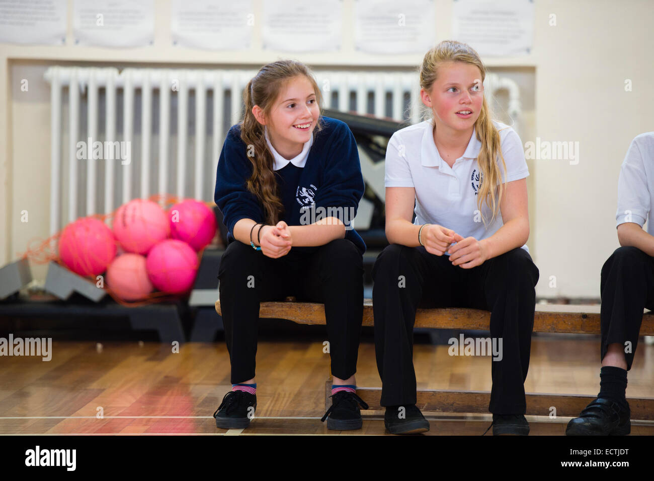 Secondary school education Wales UK: two teenage girls watching others ...