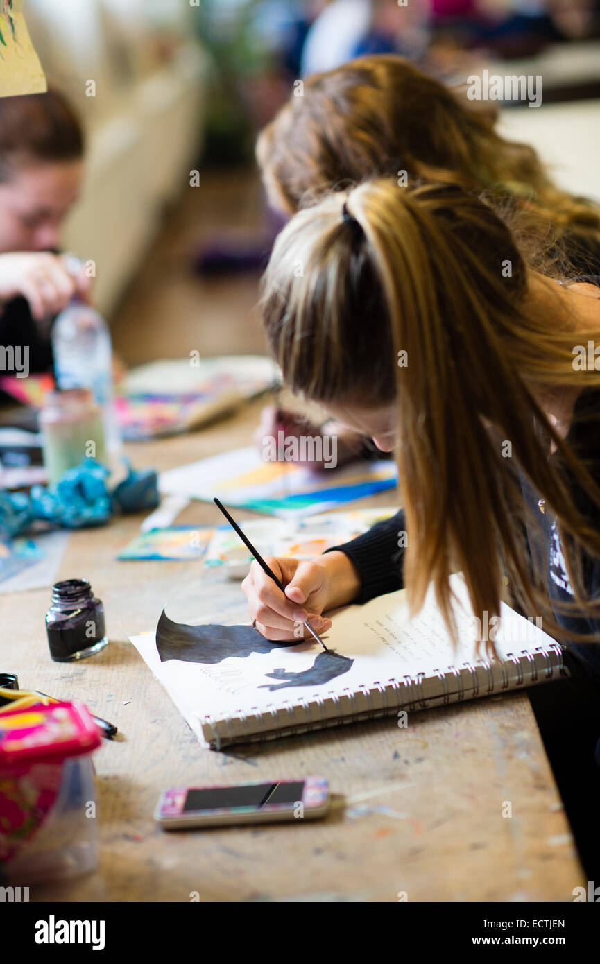 Secondary school art education Wales UK: girl pupils drawing and ...