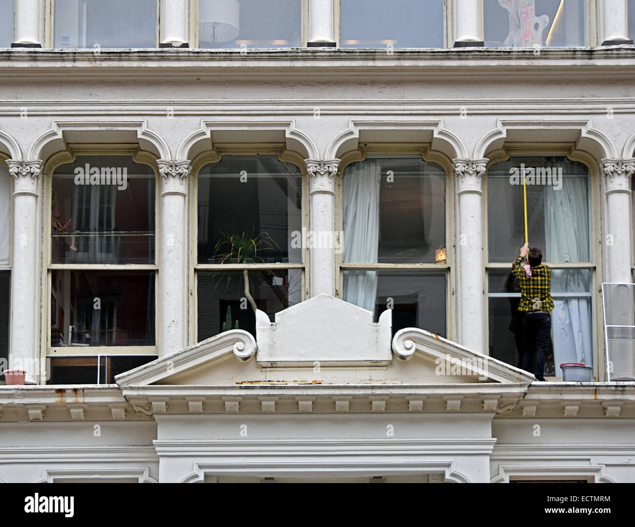 A window washer working at 1 - 5 Bond Street in Greenwich Village ...