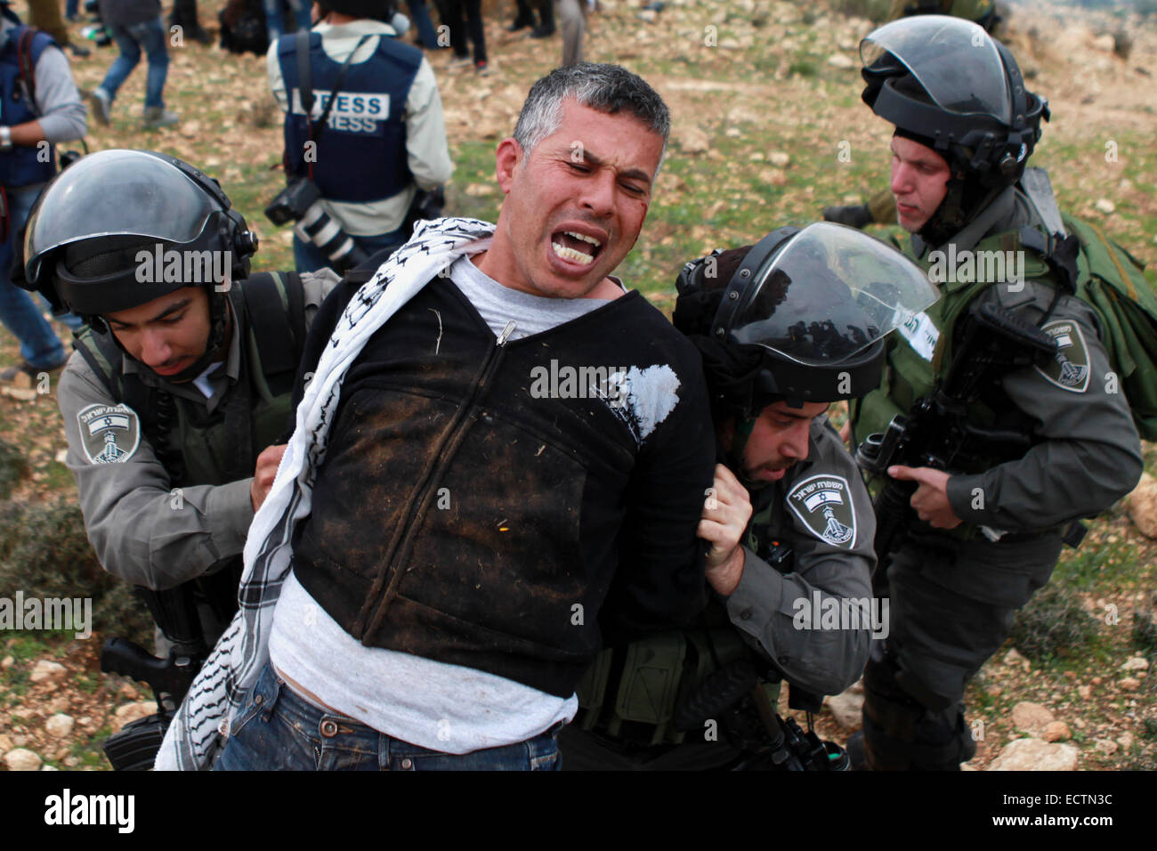 Ramallah, West Bank. 19th Dec, 2014. Israeli border police detain a ...