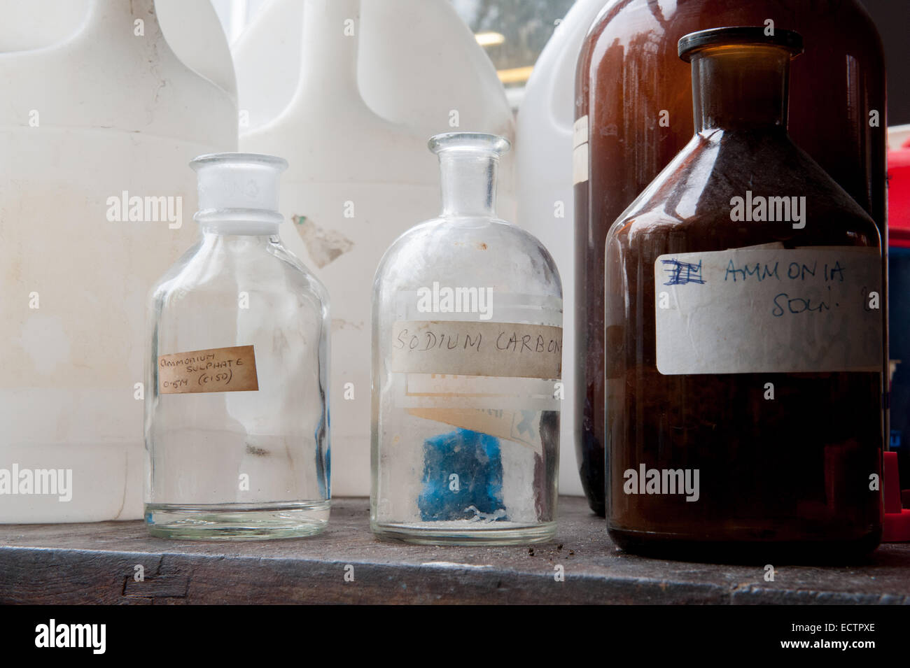 Empty chemical bottles on a shelf in a school science laboratory Stock ...