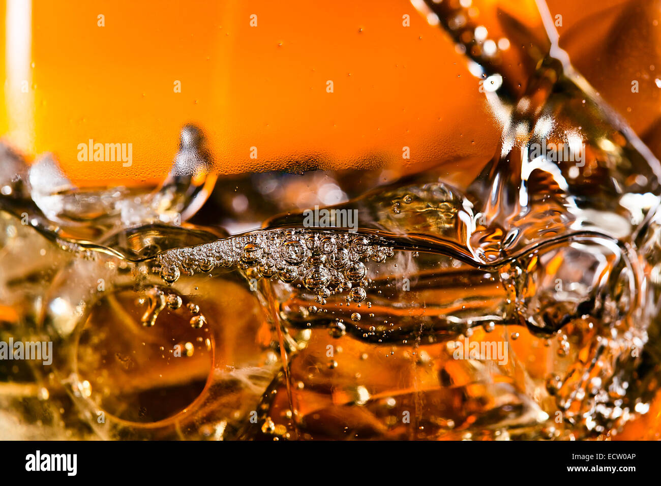 detail of an alcoholic beverage on yellow background Stock Photo - Alamy