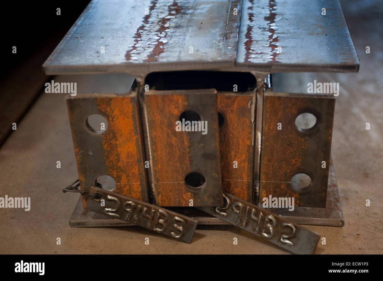 Steel I-beams with part number tags in steel fabrication plant Stock ...