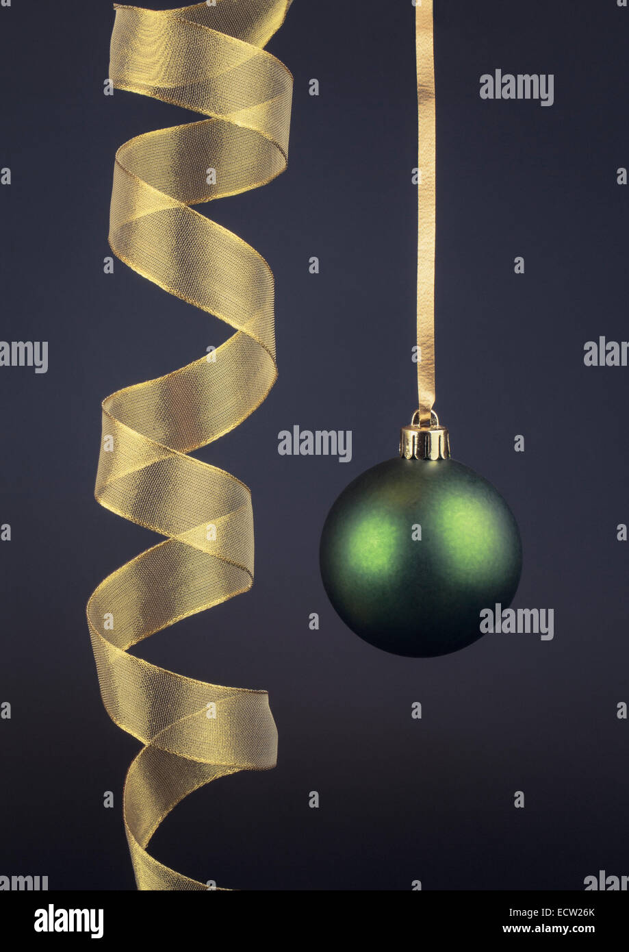 Single Christmas Bauble and gold Ribbon Stock Photo - Alamy