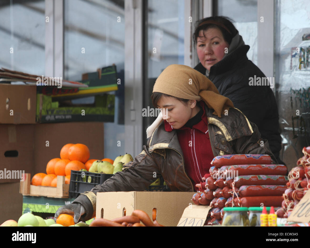 Women selling fruit at the central market of the Chechen capital Grozny ...