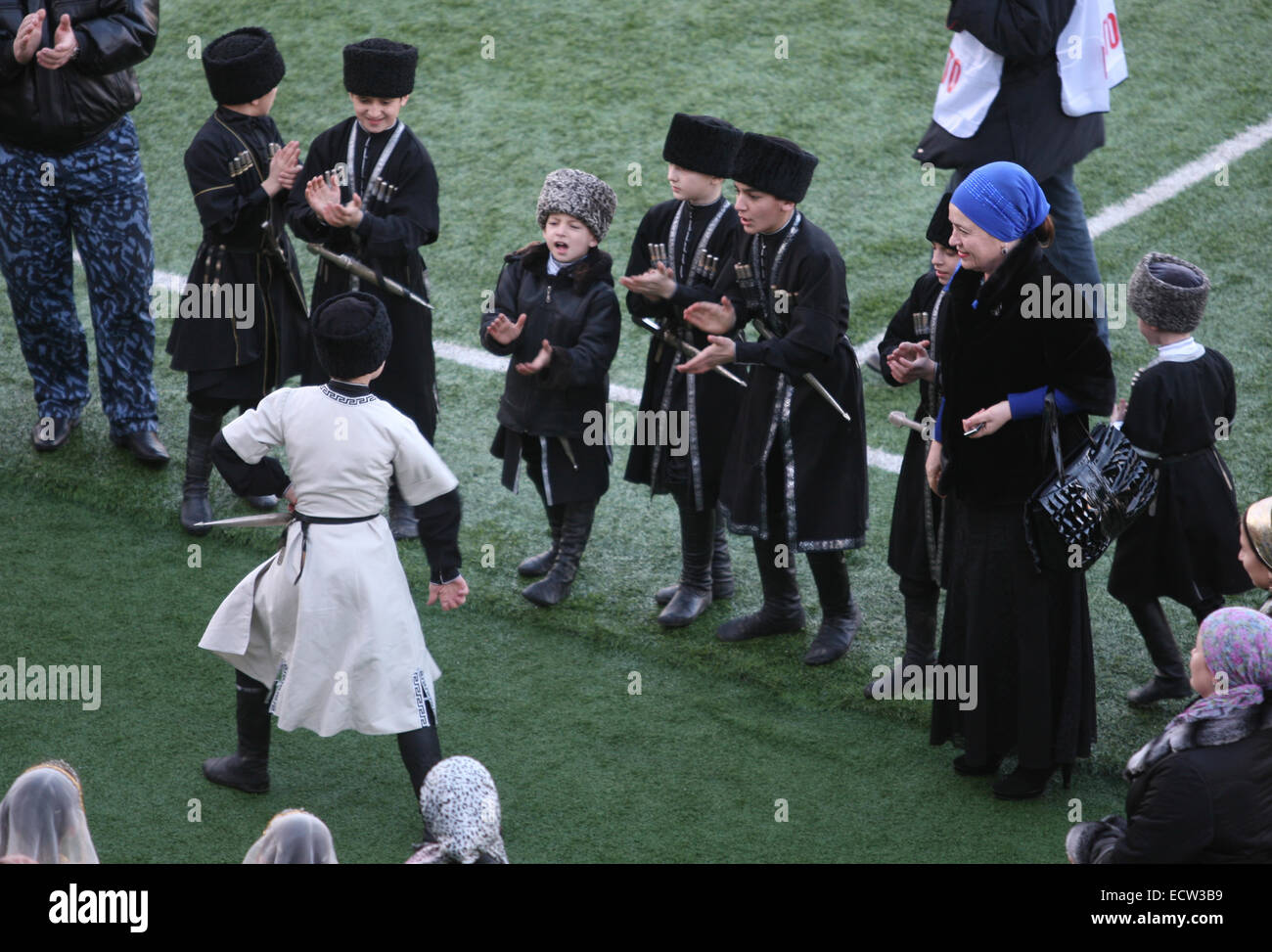 Members of the Chechen childrens' dance group Bashlam getting ready for ...