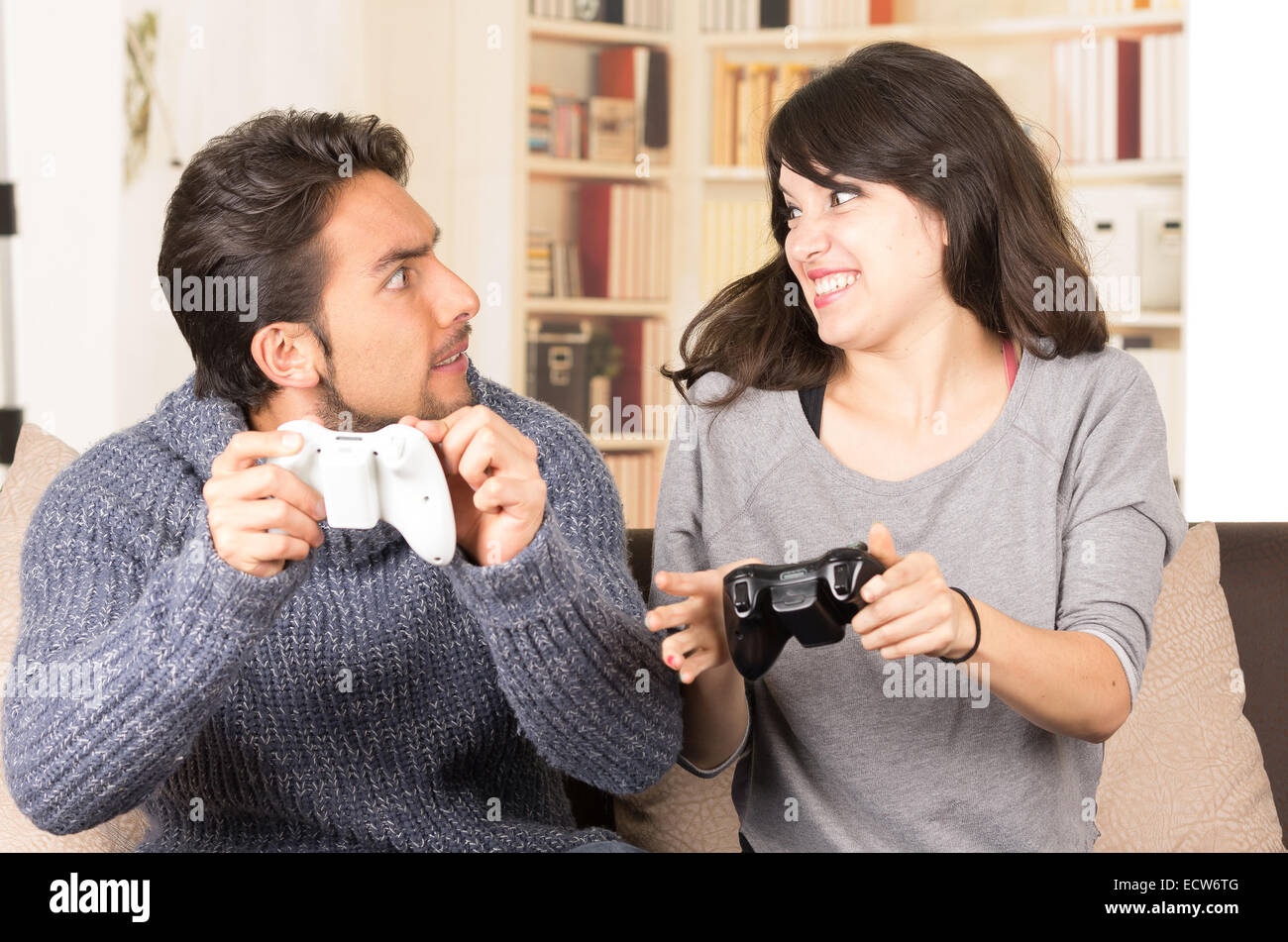 young cute couple playing video games Stock Photo - Alamy