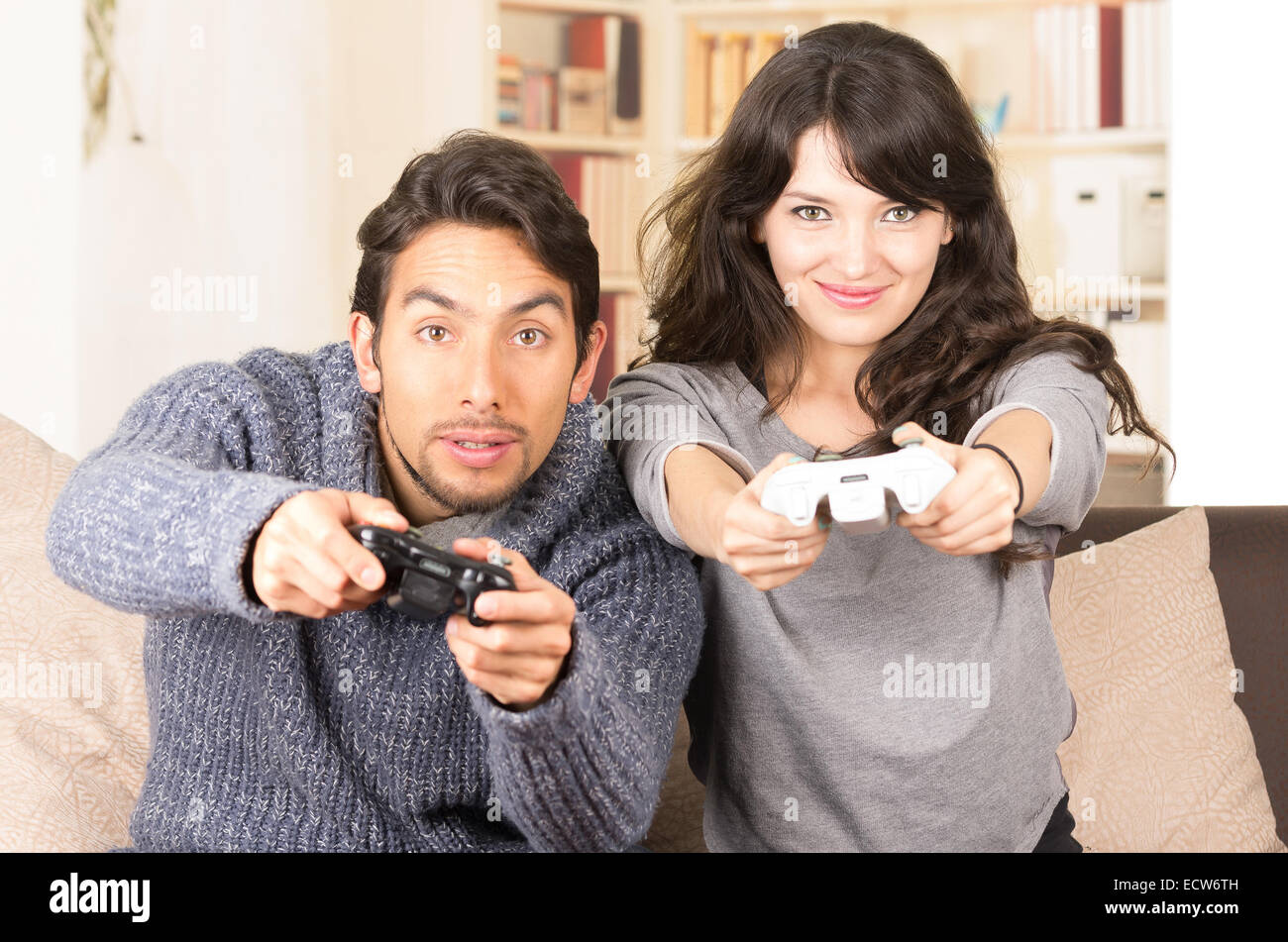 young cute couple playing video games Stock Photo - Alamy