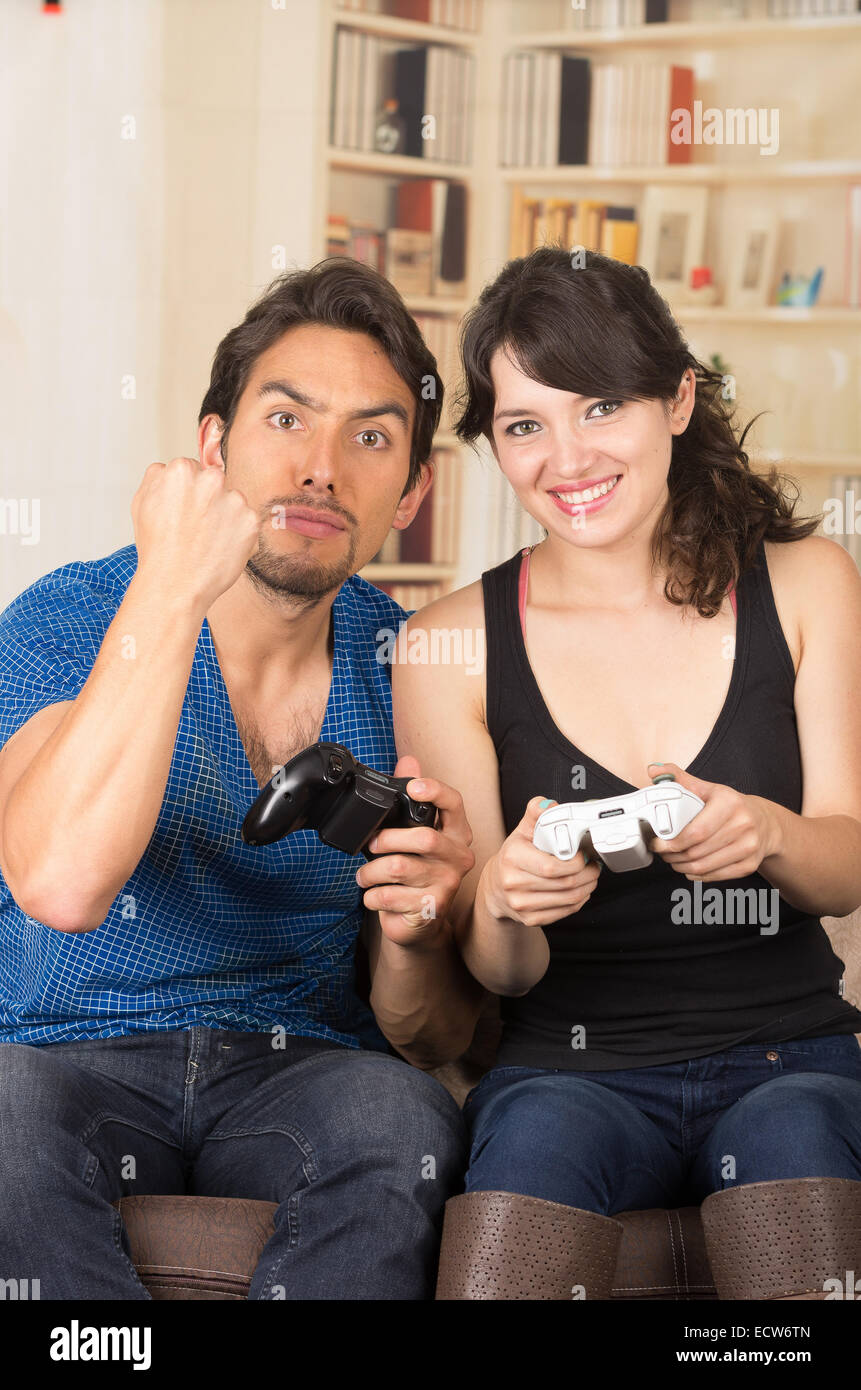 young cute couple playing video games Stock Photo - Alamy