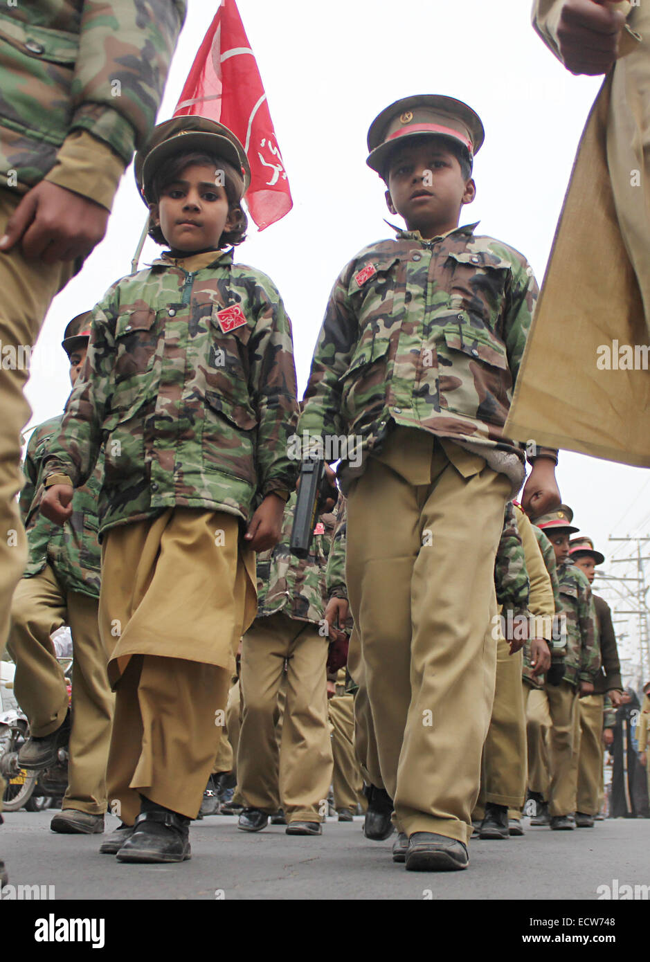 Lahore, Pakistan. 19th Dec, 2014. Pakistani students in army uniform ...