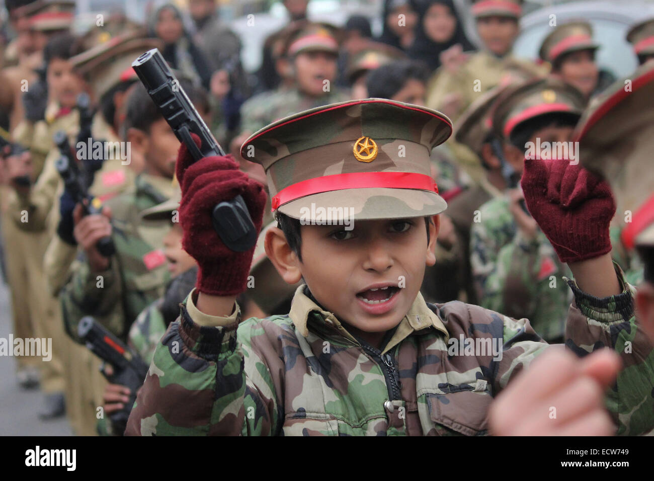 Lahore, Pakistan. 19th Dec, 2014. Pakistani students in army uniform ...