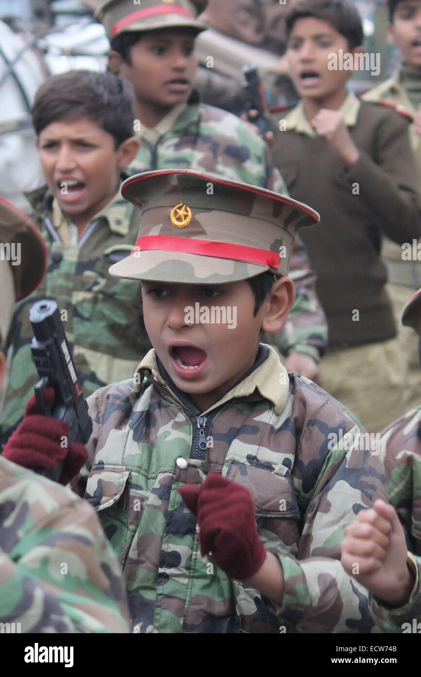 Lahore, Pakistan. 19th Dec, 2014. Pakistani students in army uniform ...