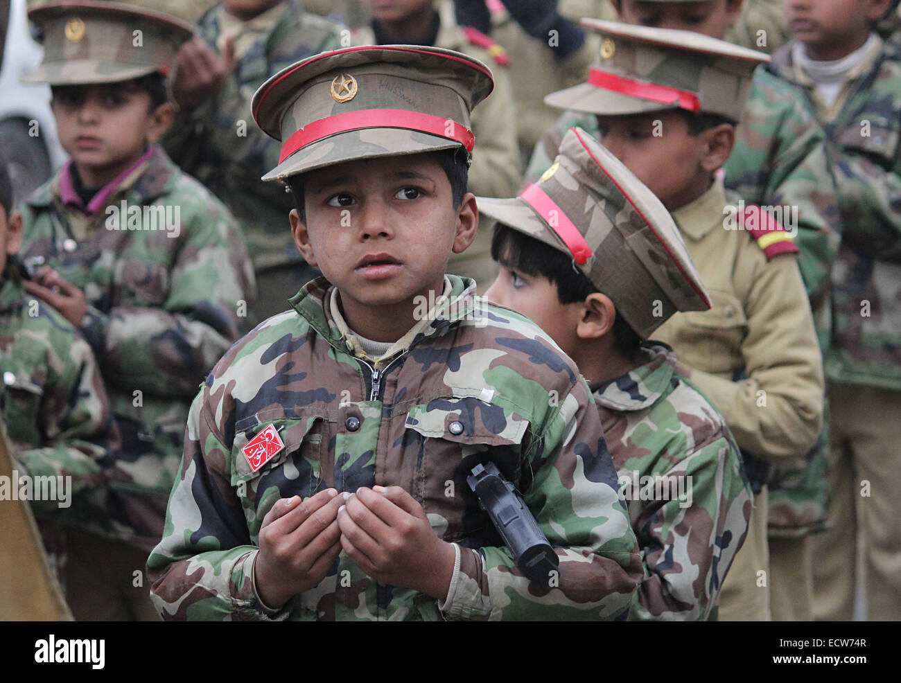 Lahore, Pakistan. 19th Dec, 2014. Pakistani students in army uniform ...