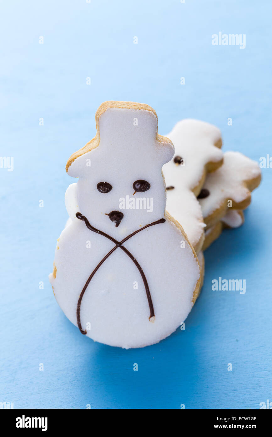 Frosted white sugar cookies in shape of snowman Stock Photo - Alamy