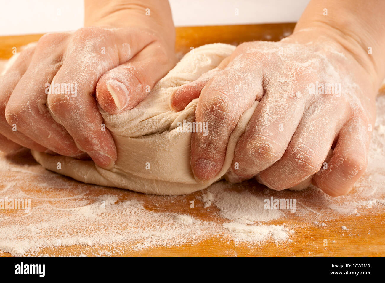 Kneading the dough with hands Stock Photo - Alamy