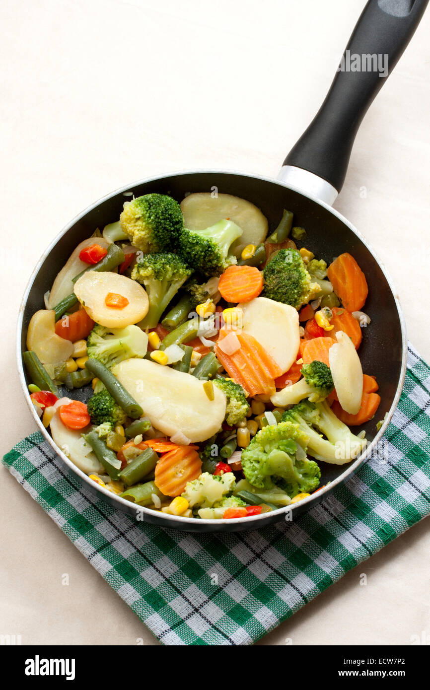 Fried vegetables in a griddle Stock Photo - Alamy