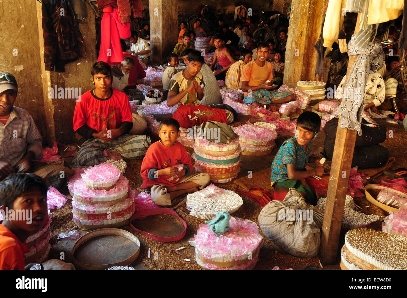 2010. Child worker at a hand rolled cigarette (locally called a bidi ...