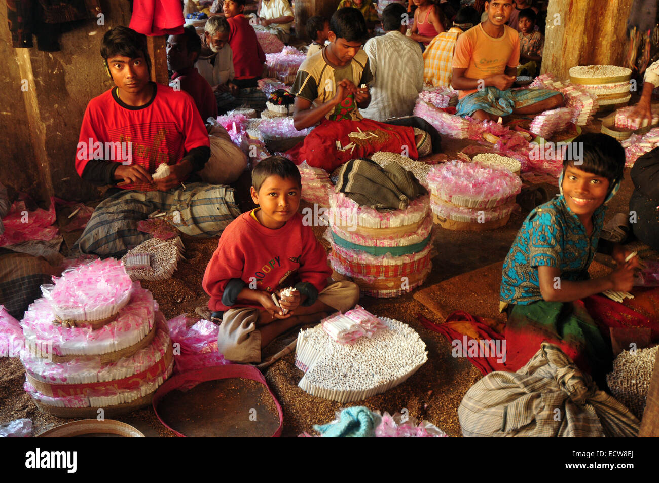 2010. Child worker at a hand rolled cigarette (locally called a bidi ...