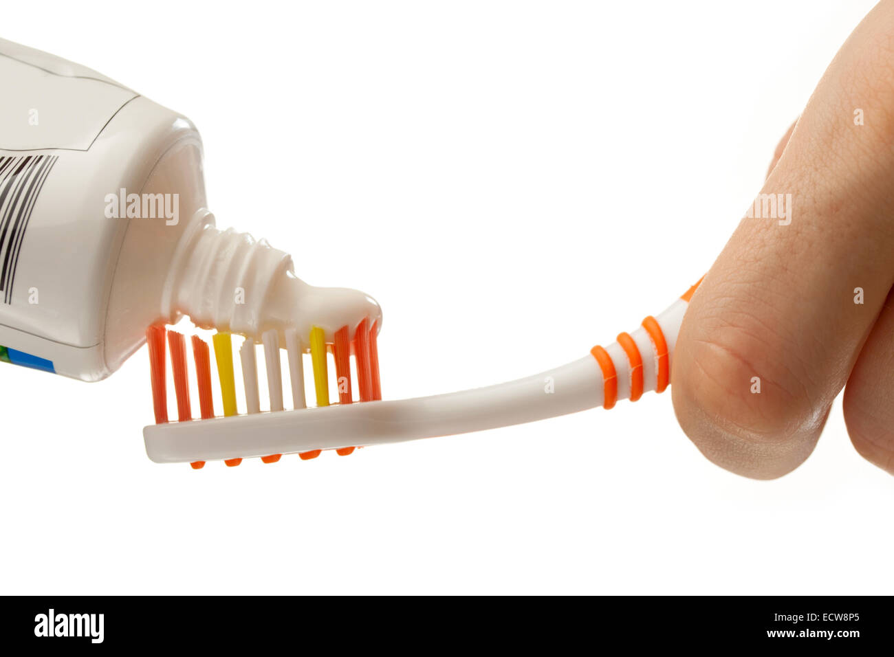 Toothbrush and toothpaste in female hands Stock Photo - Alamy