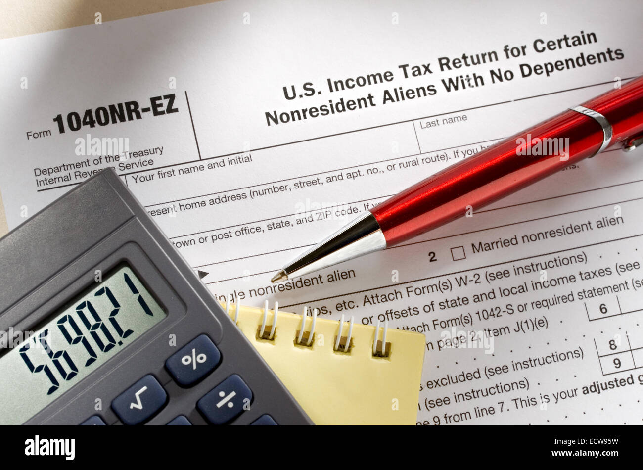 Tax form and pen Stock Photo - Alamy