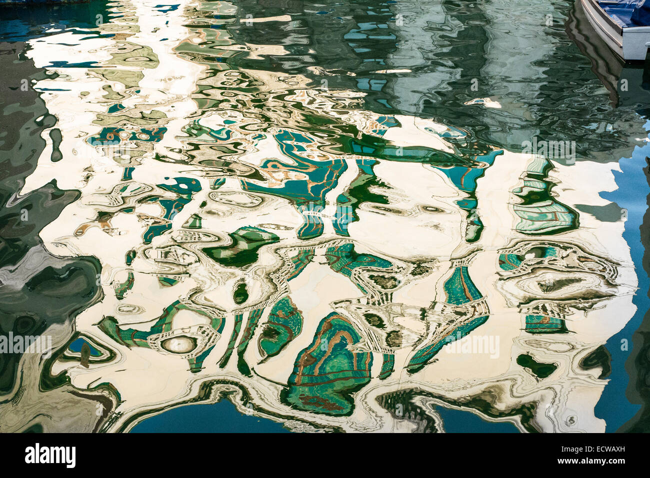 Contorted shapes on the water surface of a canal in Venice, Italy Stock ...