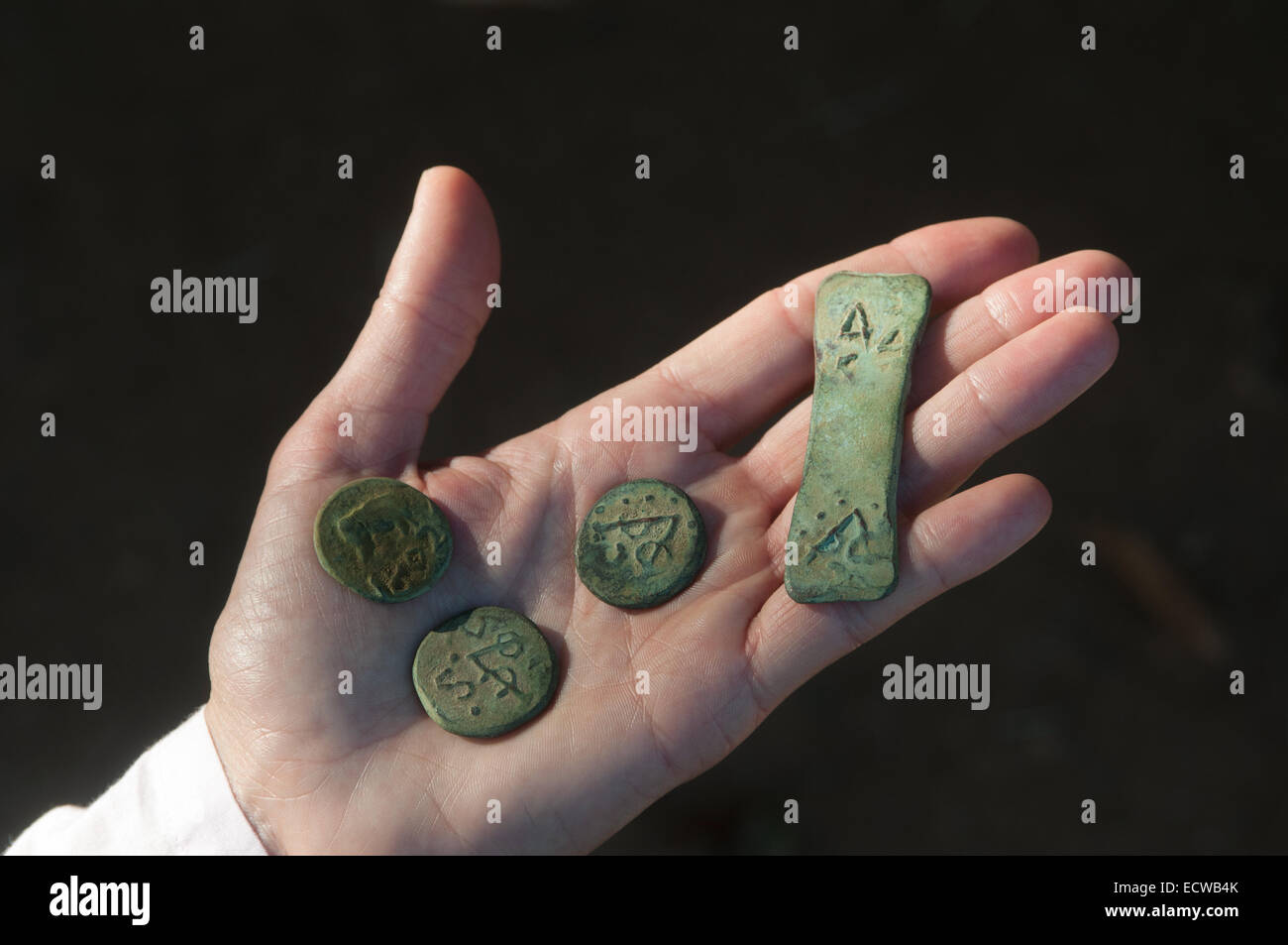 Ancient coins are situated on the palm. Coins are aeruginous Stock ...
