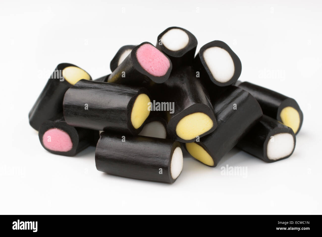 Liquorice or licorice pencils fondant filled candy Stock Photo - Alamy