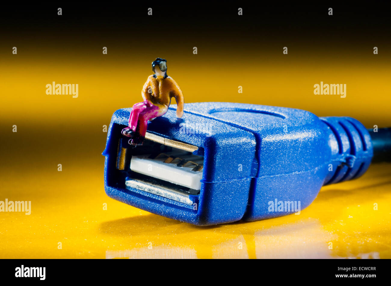 USB plug with mini figure in studio setting Stock Photo - Alamy