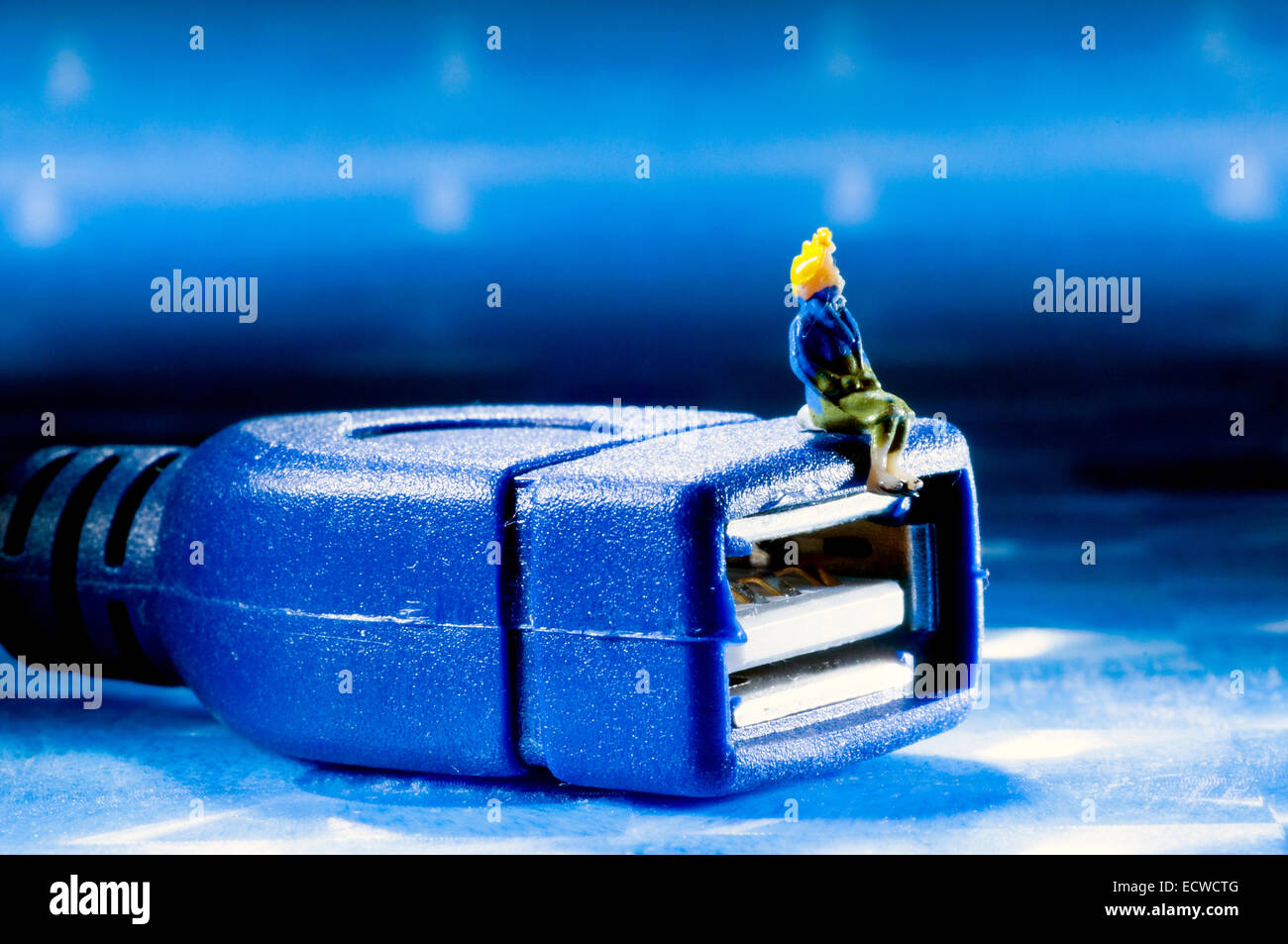 USB plug with mini figure in studio setting Stock Photo - Alamy