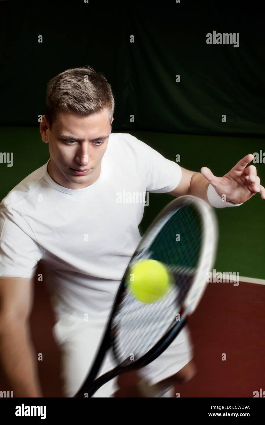 Young man playing tennis Stock Photo - Alamy