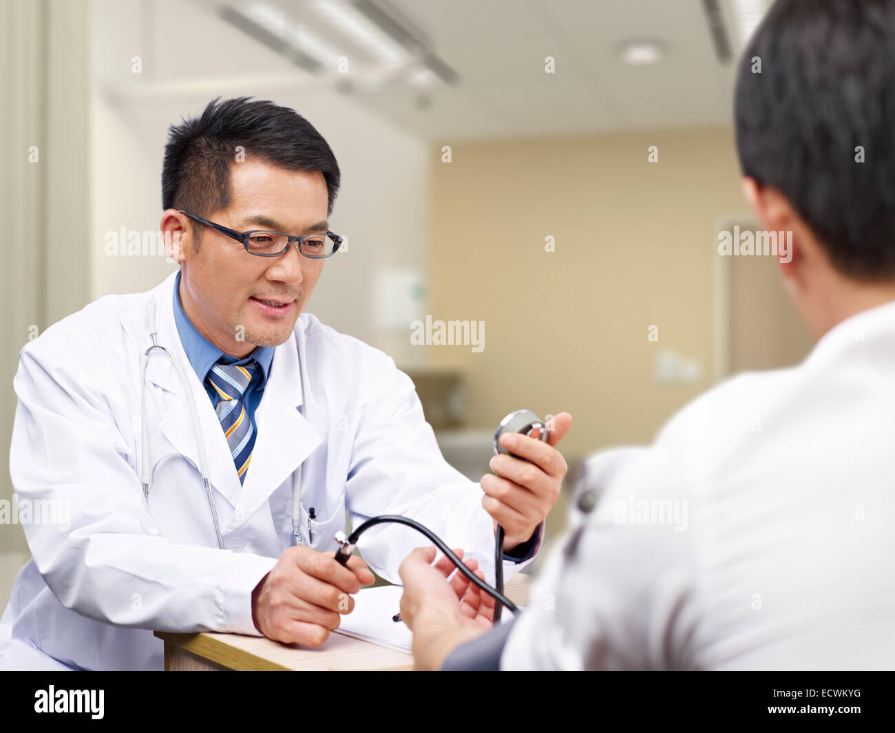 Doctor in medical office seeing hi-res stock photography and images - Alamy