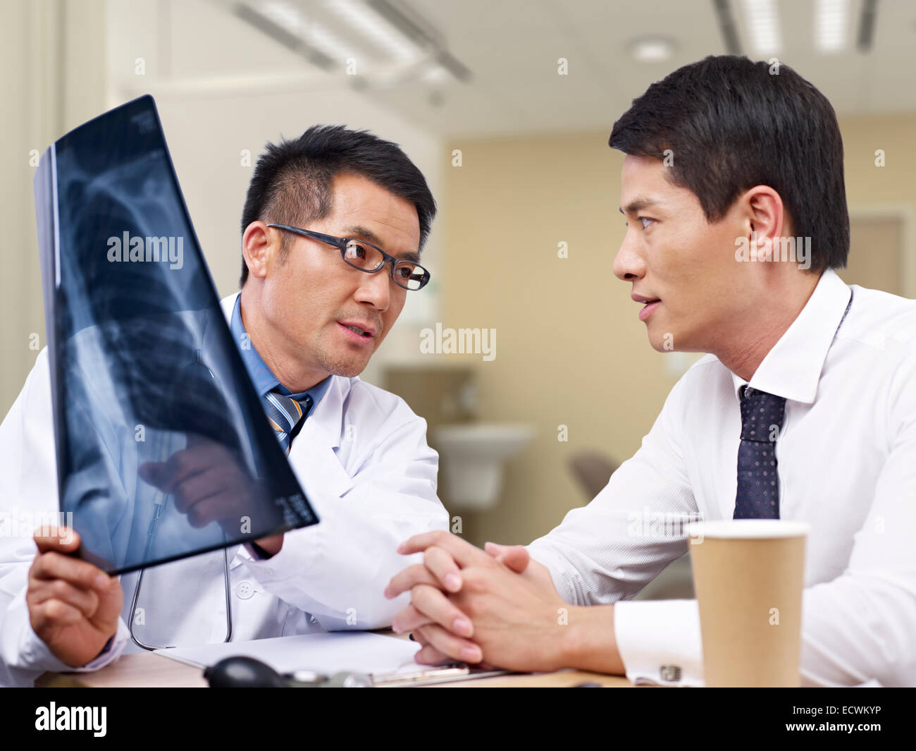 Man seeing doctor hi-res stock photography and images - Alamy