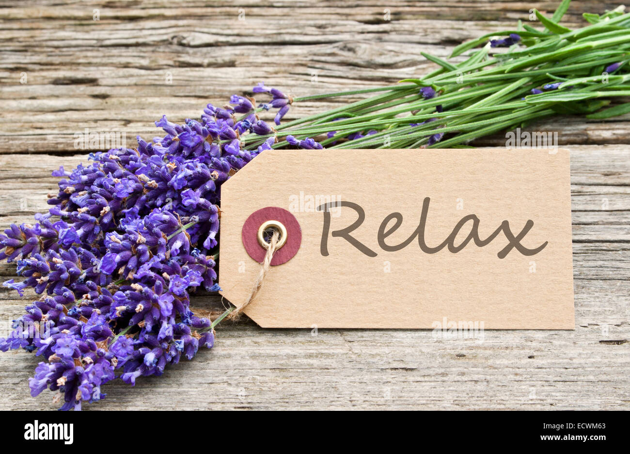Lavender flowers and tag with English text: Relax Stock Photo - Alamy
