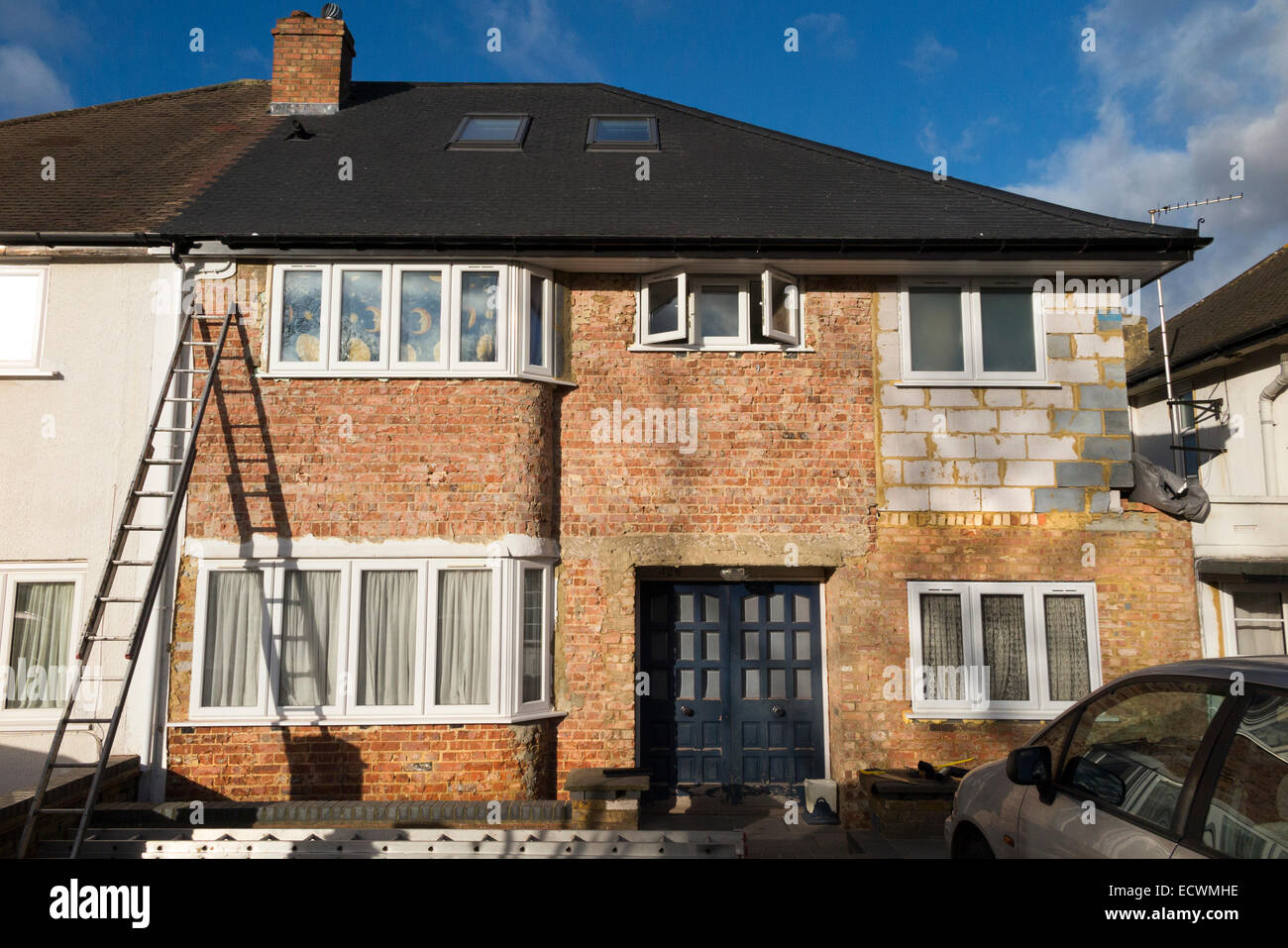 House stripped of render so that its bricks are shown again, ready to ...