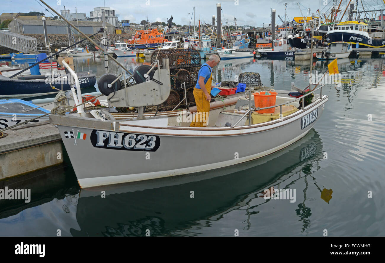 Cornish lobster fisherman Newlyn Cornwall in his fishing boat Stock ...