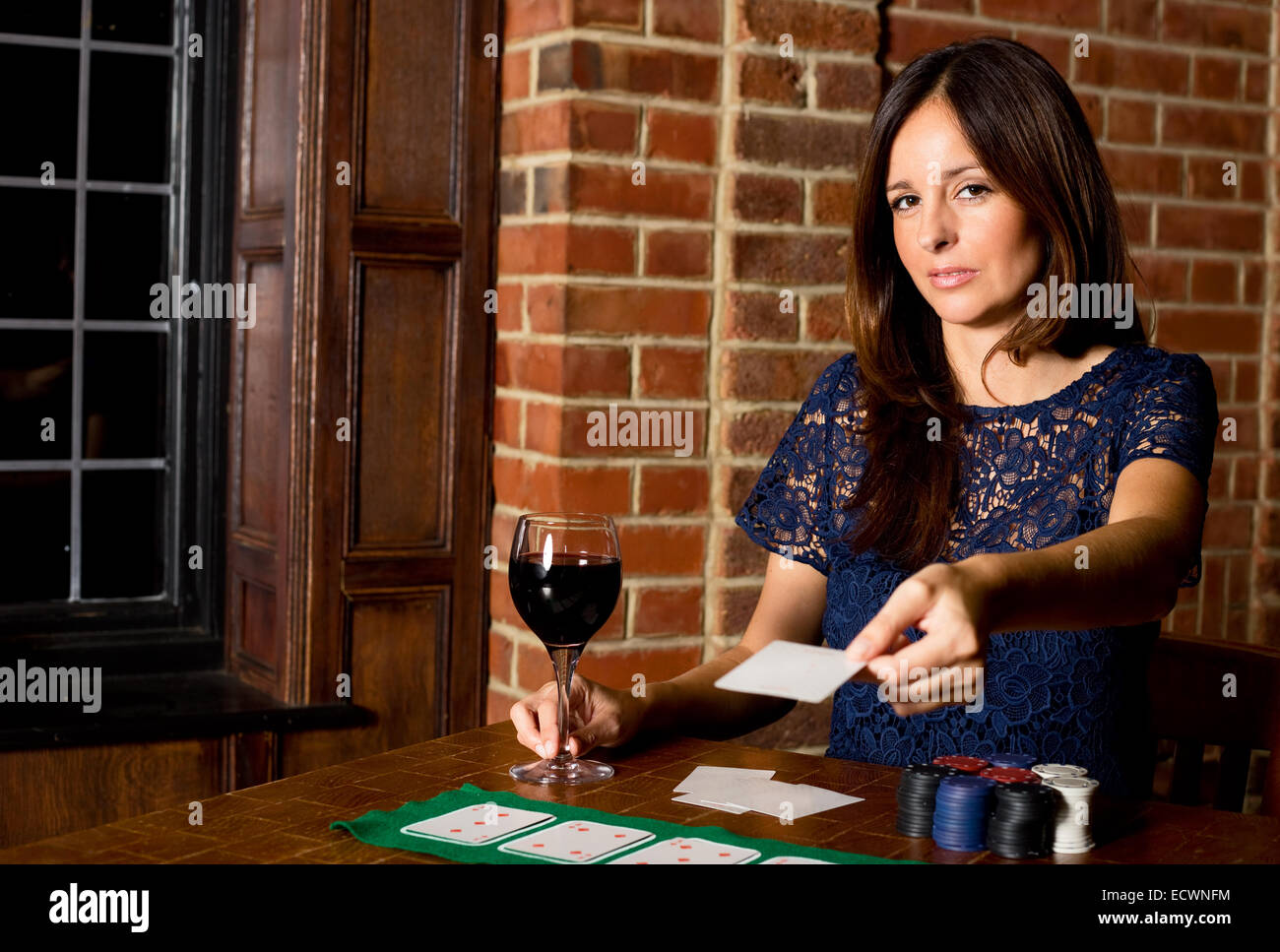 young woman playing poker Stock Photo - Alamy