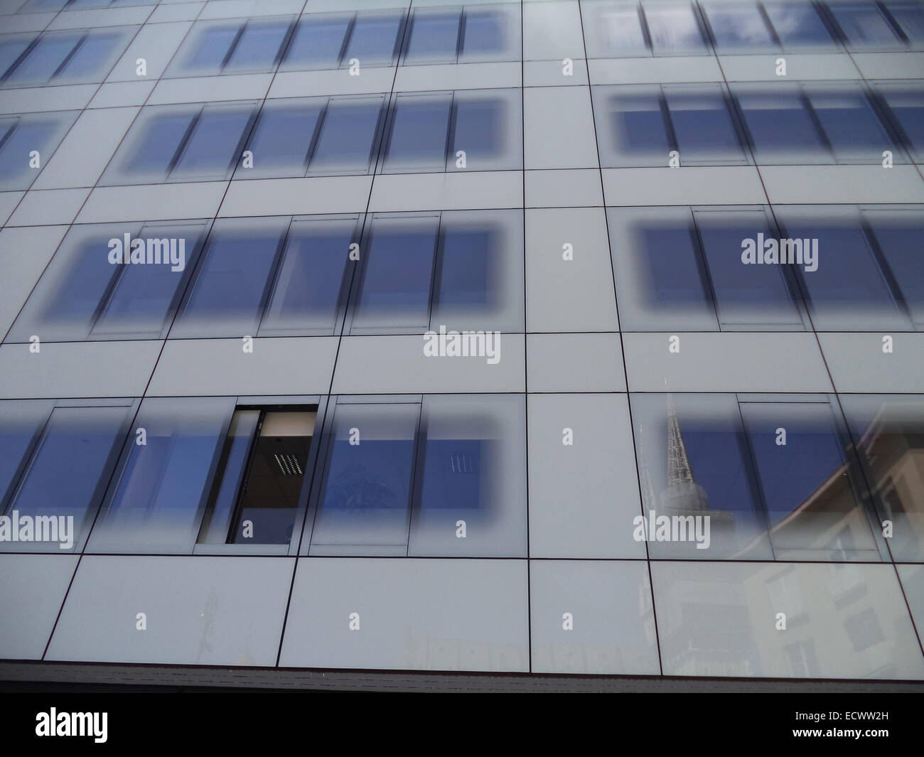 Modern glass office building with reflection and one open window Stock ...