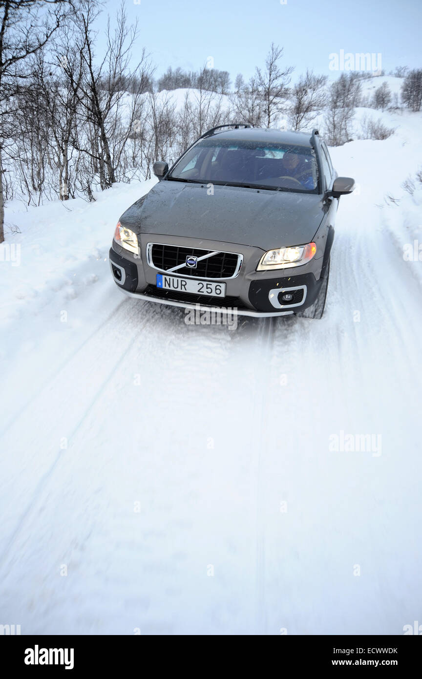 Car driving on snow and ice near the arctic circle in Sweden. Volvo ...