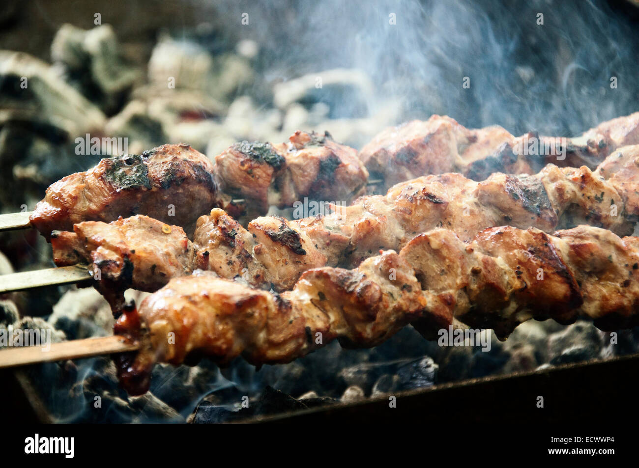 The pieces of meat roasted on a spit over charcoal Stock Photo - Alamy