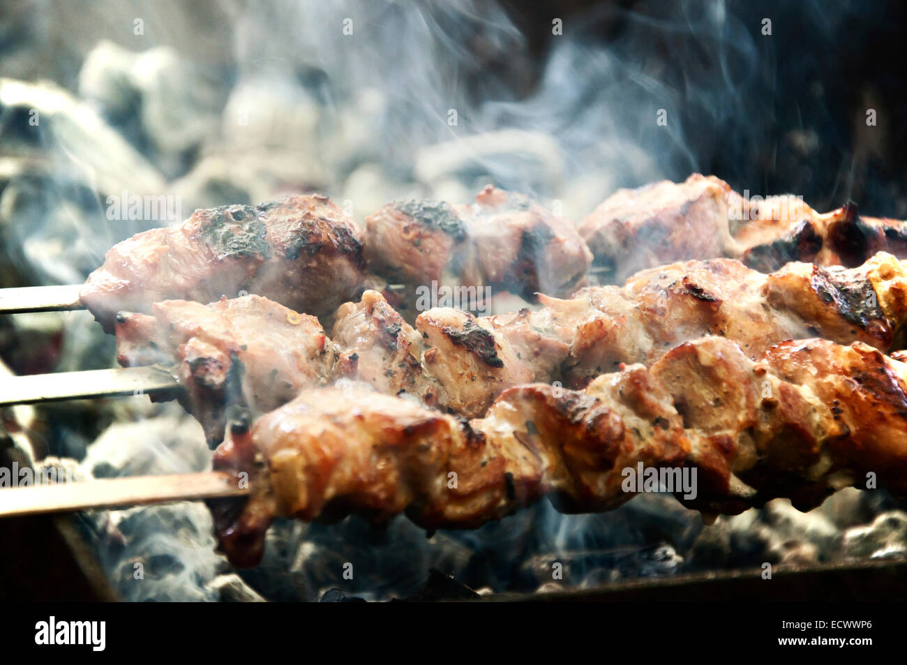 The pieces of meat roasted on a spit over charcoal Stock Photo - Alamy