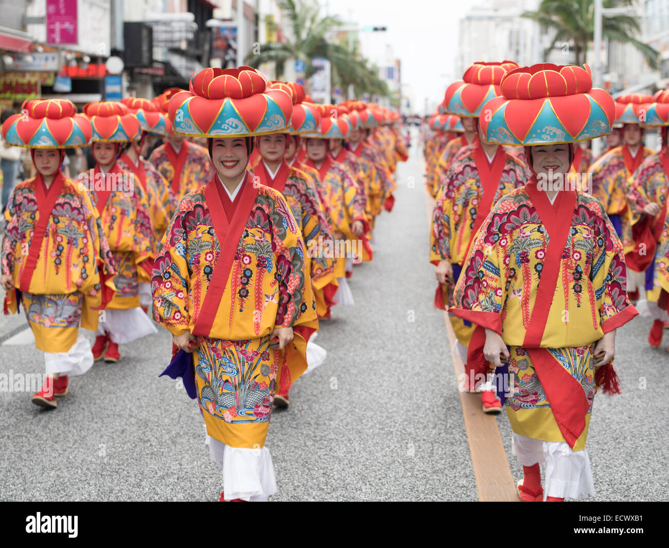 Parade of traditional ryukyu dancers wearing bingata kimonos and ...