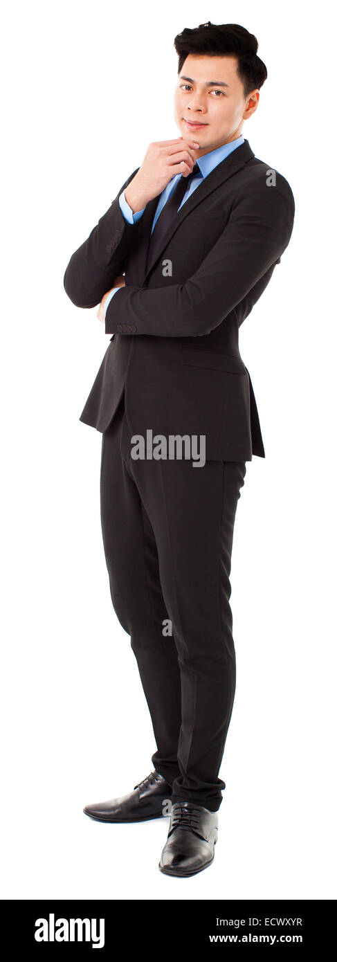 young businessman standing with thinking gesture Stock Photo - Alamy