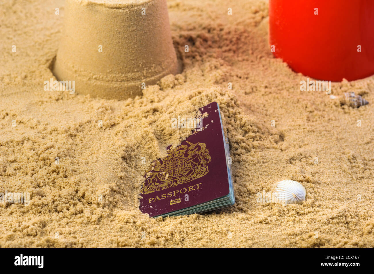 A UK passport on the beach Stock Photo - Alamy