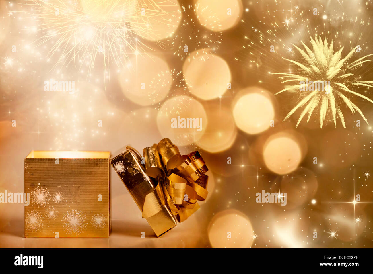 Christmas background with gift box over sparkling background and ...